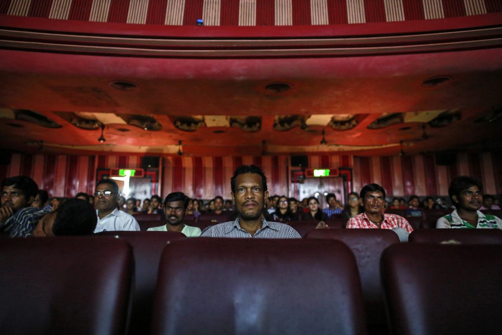 Cinema goers watch Bollywood movie “Dilwale Dulhania Le Jayenge” inside ...